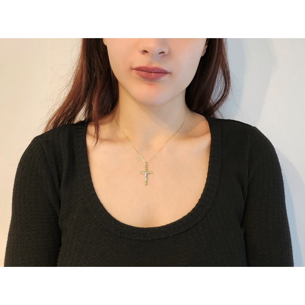 Cross with Irregular Reliefs in Yellow Gold with Christ in White